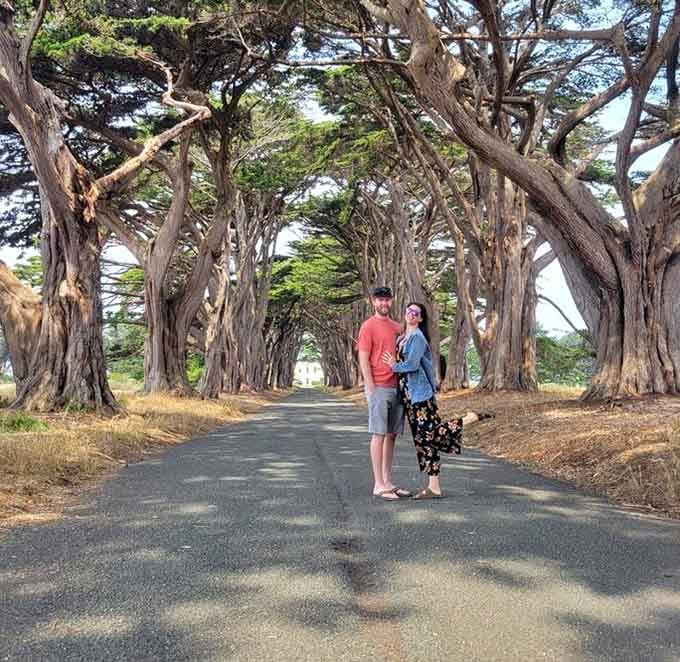 Nothing says "we made it" quite like a couple standing in nature's most photogenic hallway.