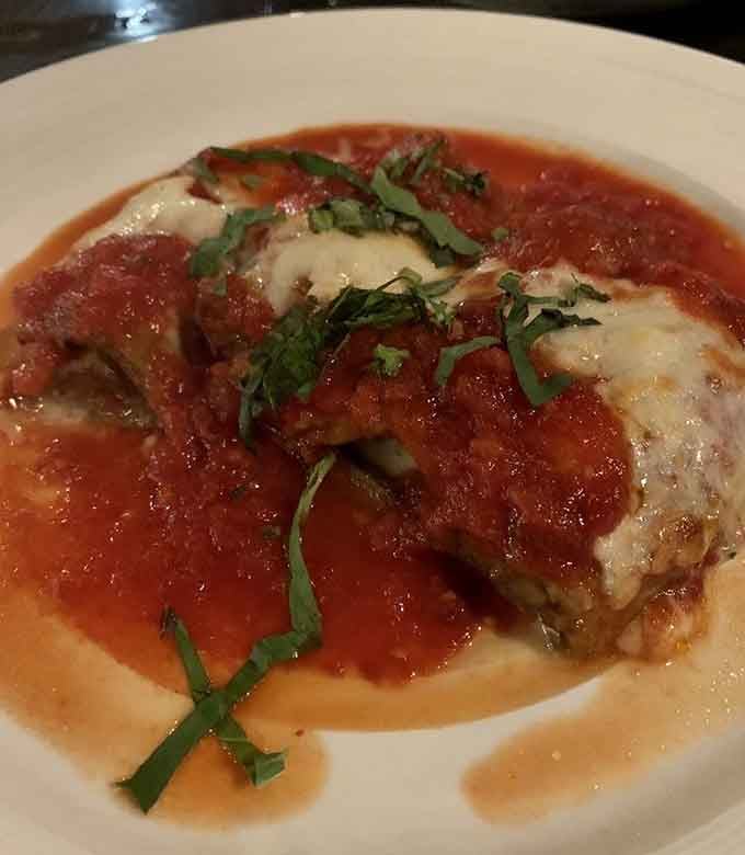 Eggplant rolls topped with melted cheese and marinara—vegetarian food that carnivores will gladly devour without complaint.