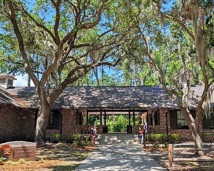 History lives under these moss-draped oaks, where colonial stories whisper through every shaded pathway and weathered brick.