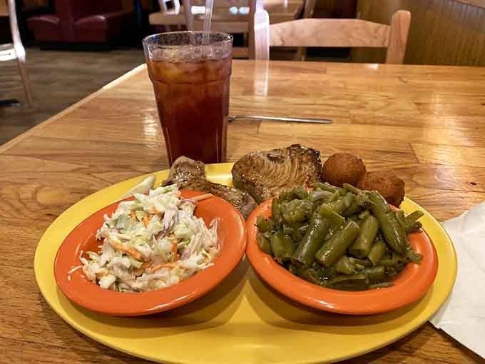 Grilled tuna with hushpuppies and coleslaw represents the holy trinity of coastal Carolina comfort food done right.