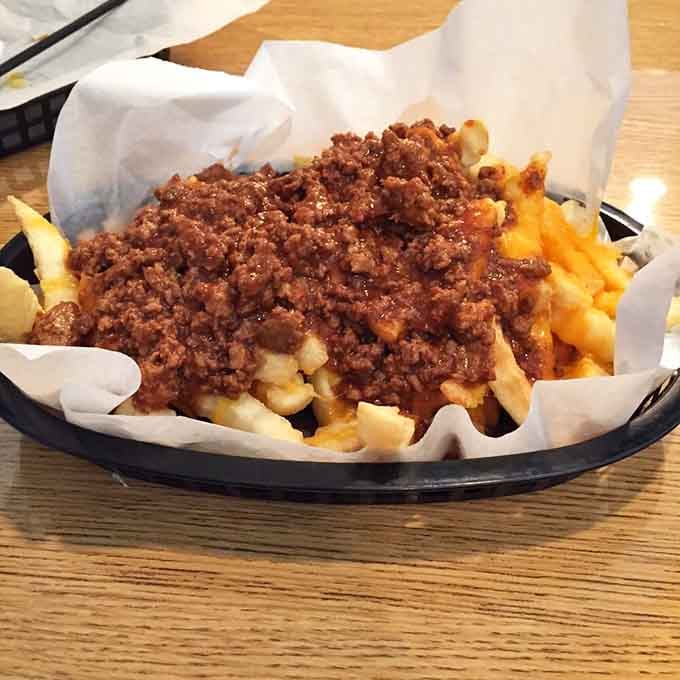 Chili cheese fries piled high enough to feed a small army, or one very determined person with excellent life priorities.
