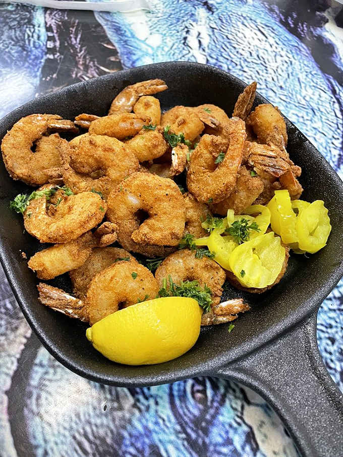 Crispy fried shrimp with lemon wedges, simple and delicious, like the ocean decided to crash your prehistoric party.