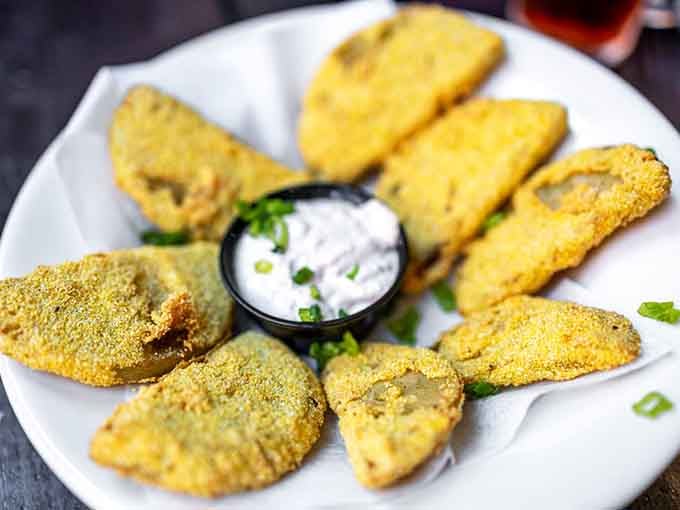 Fried green tomatoes with a golden cornmeal crust that would make your Southern grandmother nod in approval and ask for seconds.