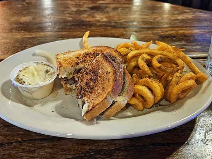 Those golden curly fries are twisted into submission and fried to crispy perfection, making them the perfect sidekick to any main course on the menu.