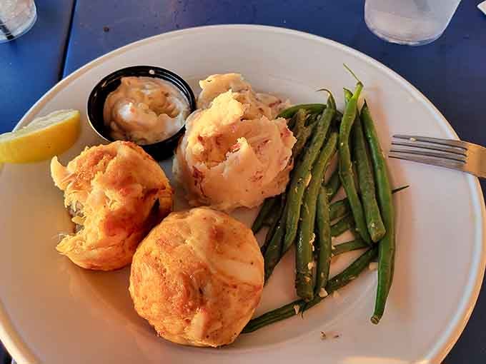 Golden crab cakes with green beans prove that simple plating lets the star ingredient shine brightest.