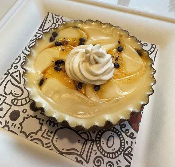 That passion fruit creation with whipped cream and chocolate chips is prettier than most things in art museums.