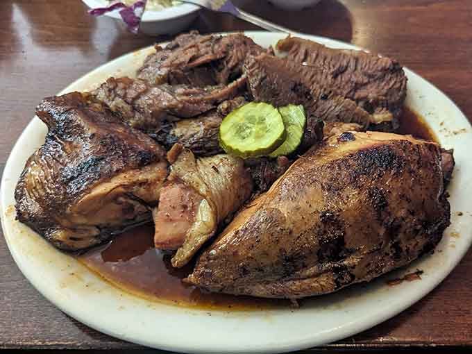 Smoky brisket meets juicy chicken with pickles standing guard, because every great plate needs a sidekick.