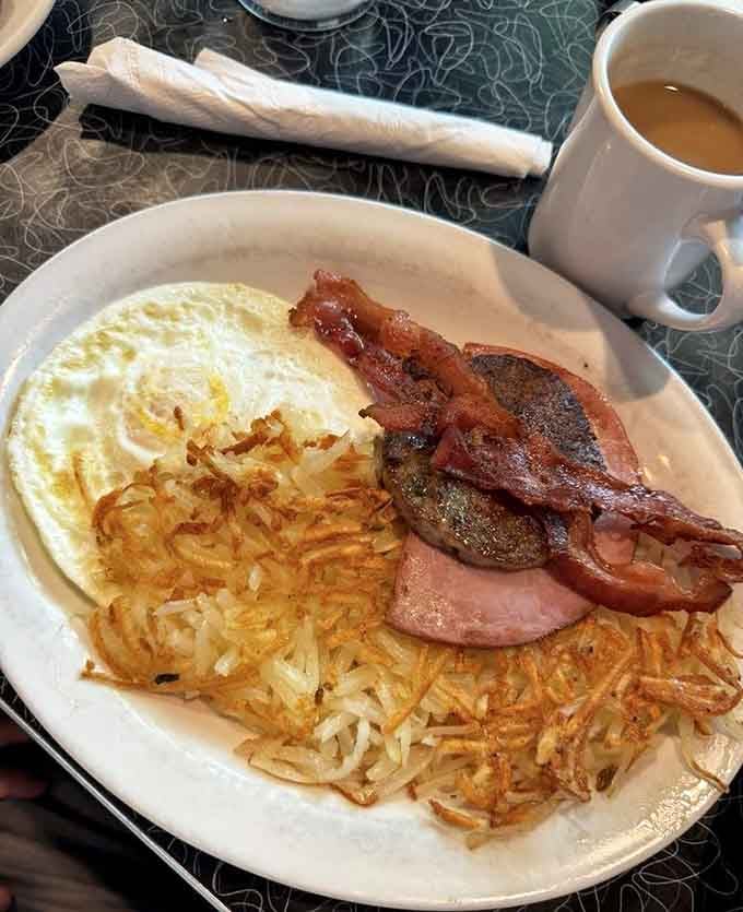 Bacon, eggs, sausage, and hash browns team up like the Avengers of breakfast to save your morning.