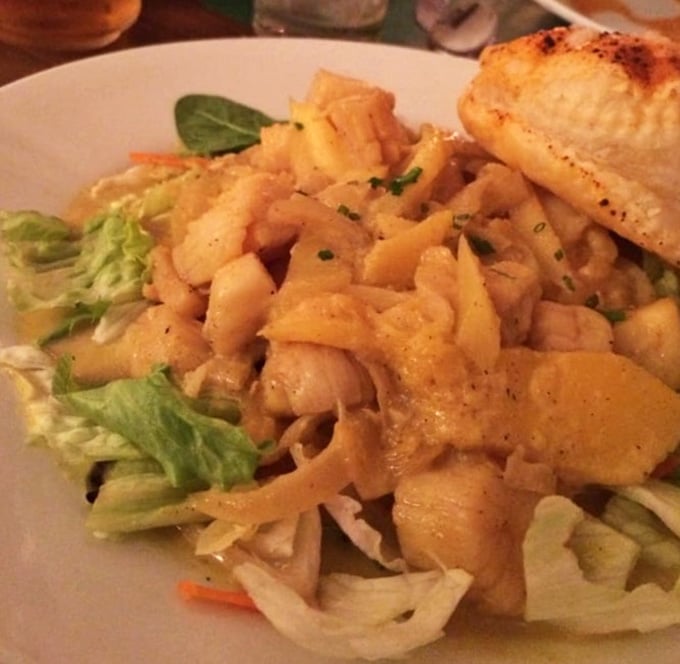 Curried scallops with mango over fresh greens prove Erwin's isn't afraid to get a little adventurous.