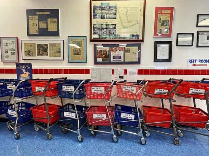 Those red shopping baskets lined up like soldiers, ready to carry your treasures to checkout and beyond.