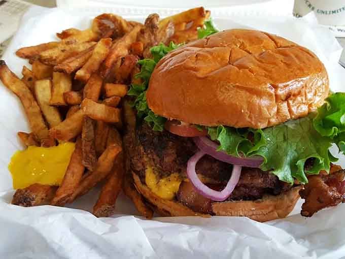A burger so generously stacked it requires architectural planning and possibly a structural engineer to eat properly.