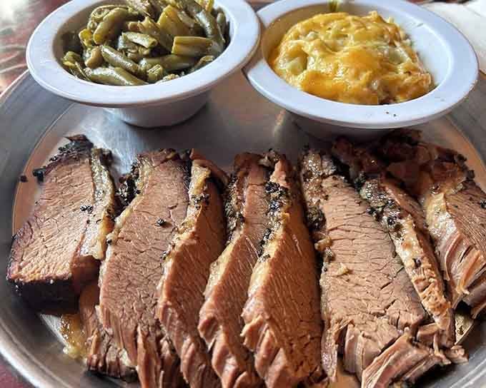 Tender brisket slices paired with mac and cheese and green beans make this plate a Southern comfort trifecta.