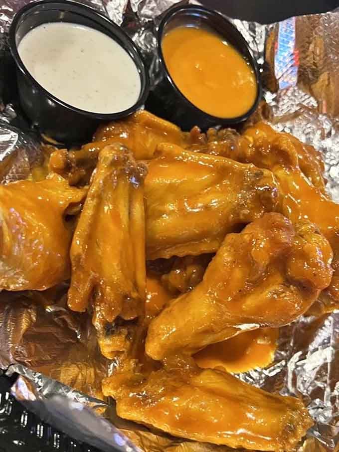 Hot wings glazed in sauce so shiny you can practically see your reflection before diving in.