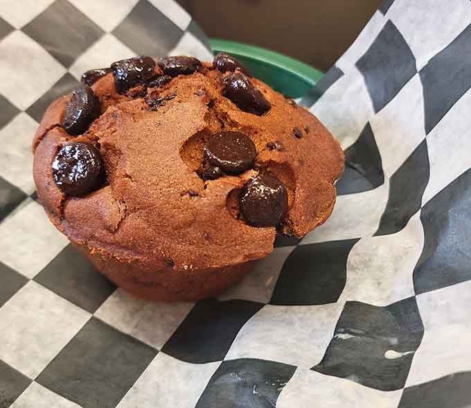 That chocolate chip muffin looks like it could put out fires of hunger with its generous size and melty chips.