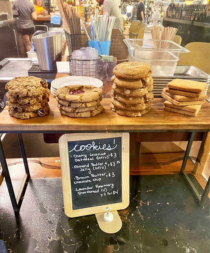 Fresh cookies stacked high at the counter, because reading and wine deserve a sweet supporting cast.