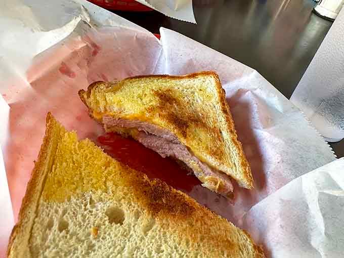 Sometimes the simplest things done right are the most satisfying, like this perfectly grilled ham and cheese masterpiece.