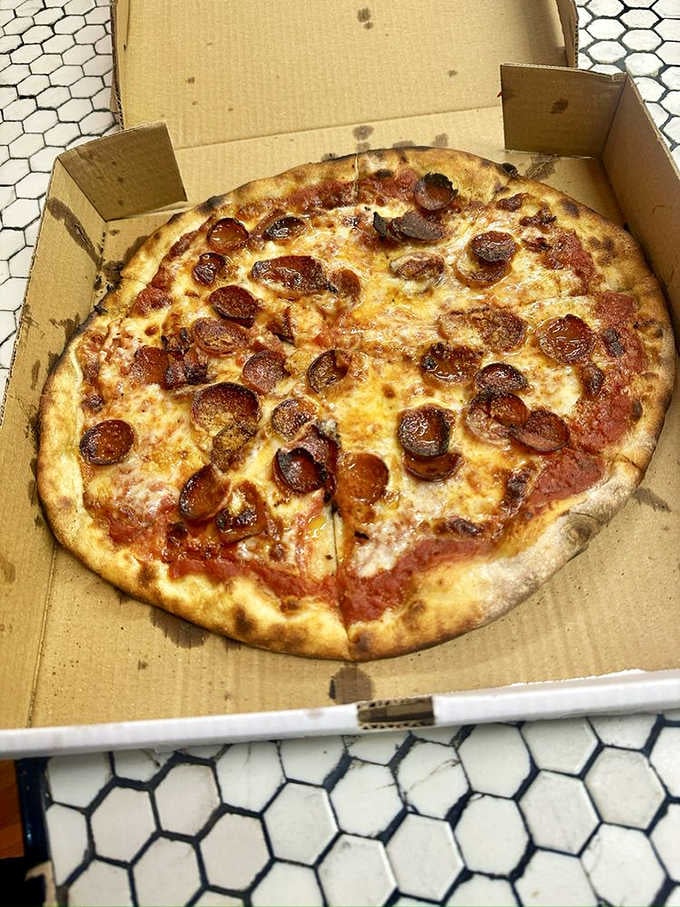 Pepperoni gets the coal-fired treatment here, emerging with crispy edges that cup pools of flavorful oil like tiny delicious bowls.