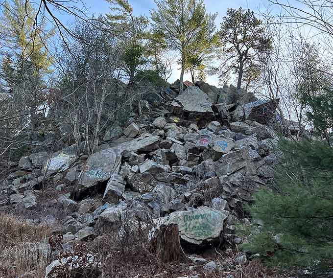 Granite formations tell stories of quarrying days, when this forest echoed with very different sounds.