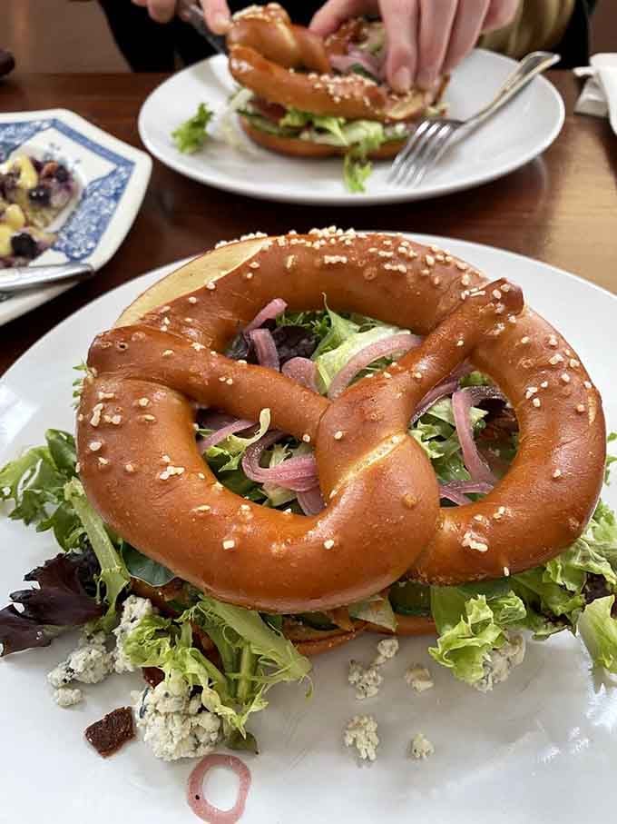 This towering pretzel creation with bacon and greens makes you rethink everything you thought sandwiches could be.