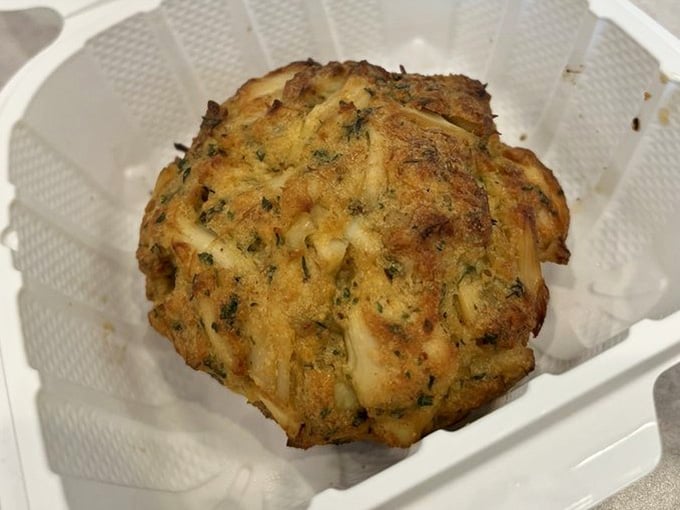 A golden crab cake that looks like it just won the lottery and decided to share its wealth.