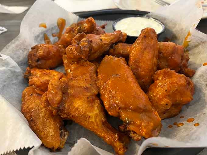 Golden wings glistening with sauce are the universal language of happiness, spoken fluently at Gabby Goat.