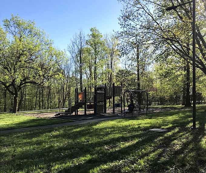 The playground gives kids a place to burn energy while parents contemplate the peaceful forest surrounding them.