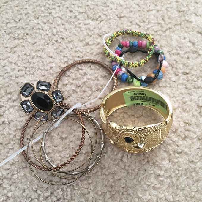 Bracelets and bangles proving that one person's jewelry box cleanout is another person's fashion statement waiting to happen.