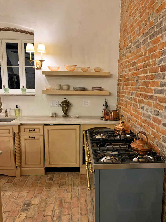 That exposed brick wall brings authentic character no faux finish could ever hope to replicate in a lifetime.