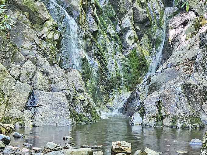 Water cascading over ancient stone, creating nature's own meditation soundtrack for weary souls.