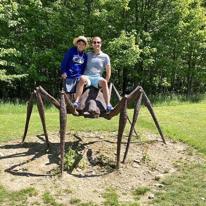 Nothing says family bonding like sitting together on a giant spider while grinning for the camera.