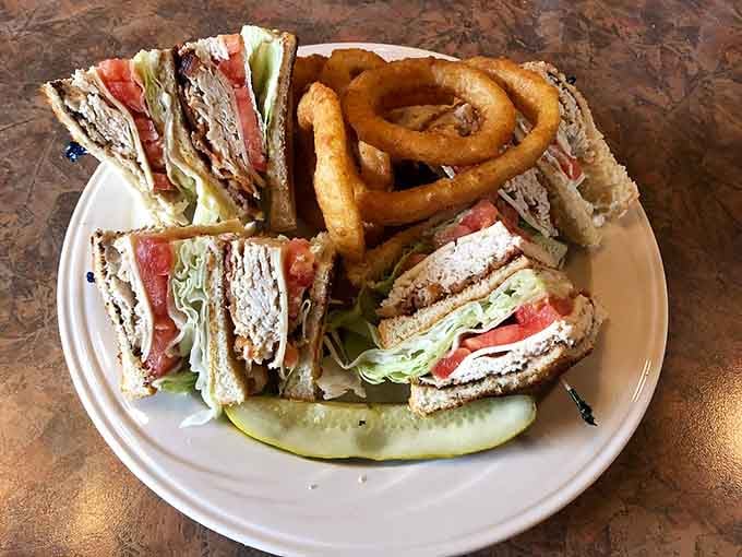 This club sandwich stacks turkey, bacon, and all the fixings like it's building a delicious skyscraper.
