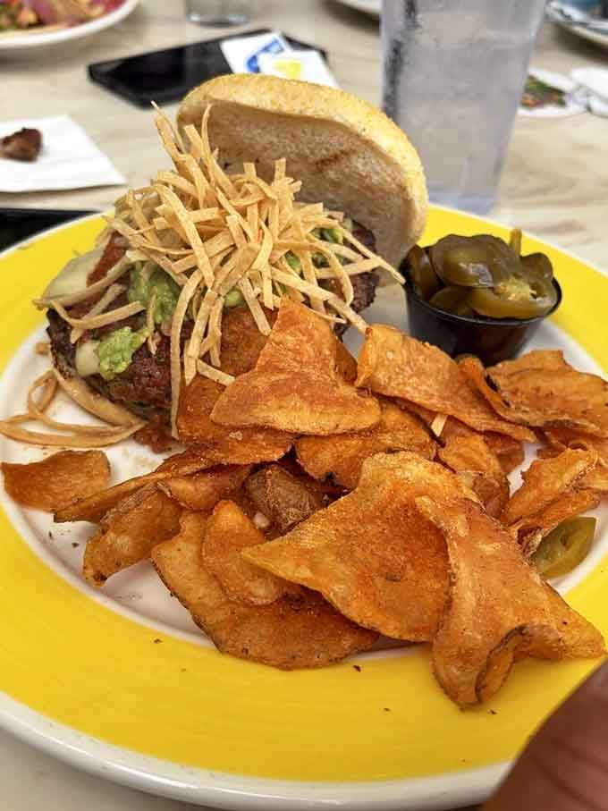 This burger topped with crispy tortilla strips defies gravity and possibly several laws of sandwich construction physics.