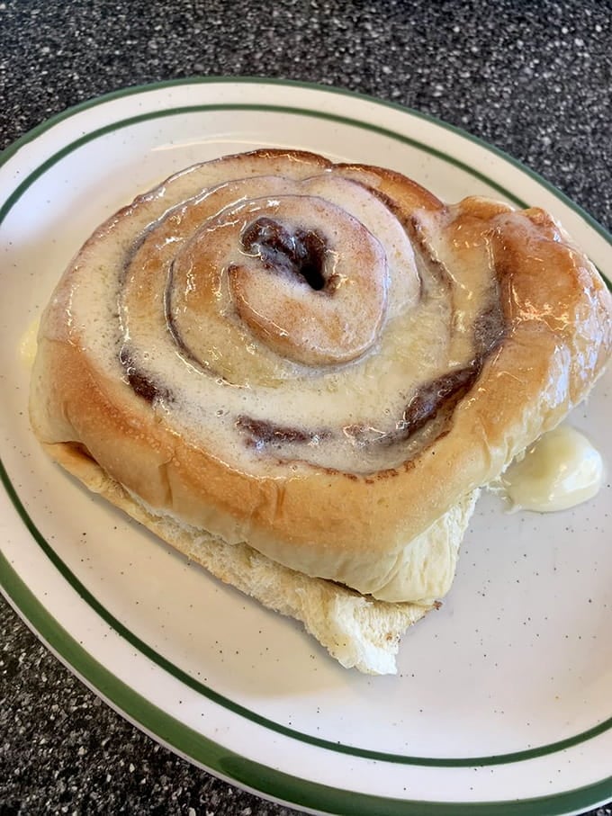 This cinnamon roll is bigger than your head and twice as sweet, dripping with icing like it means business.