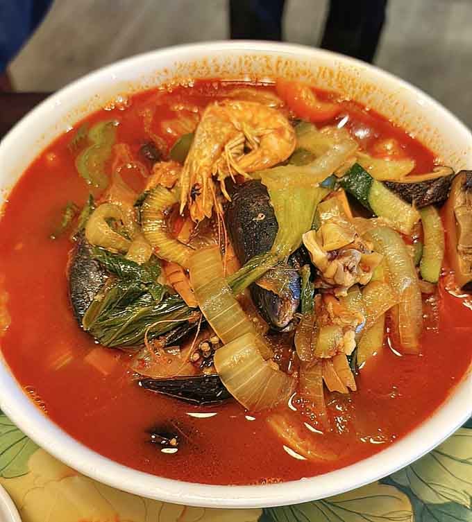 Red broth, fresh seafood, chewy noodles. This jjamppong brings the heat and the flavor in equal measure.