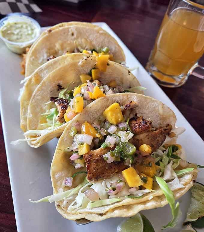 Fish tacos topped with fresh mango salsa bring a taste of the coast to landlocked Michigan.
