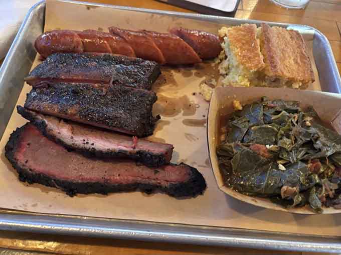 Brisket and sausage sitting together on a tray, proving that some partnerships are simply meant to be forever and always.