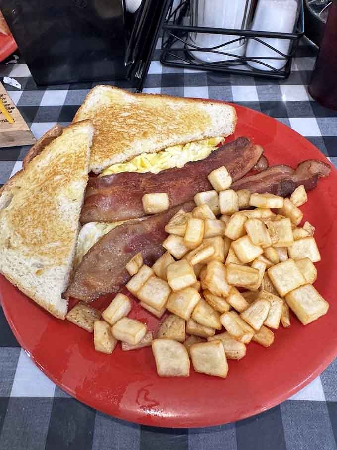 This classic American breakfast proves that some combinations are timeless: bacon, eggs, toast, and those irresistible little potato cubes.