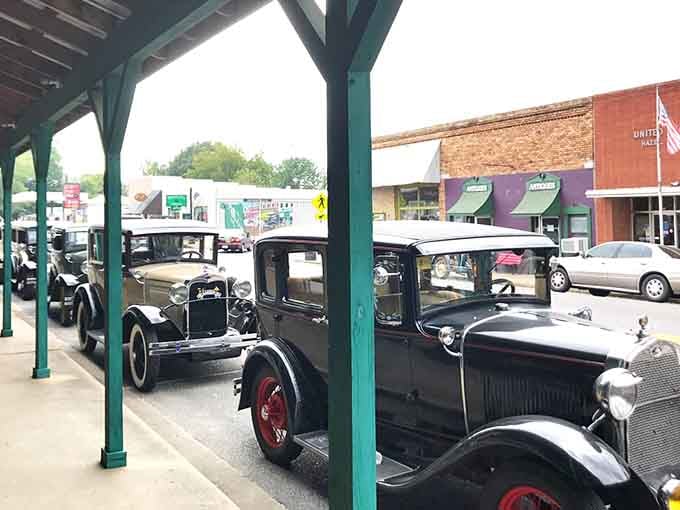 Vintage automobiles rest under cover like automotive royalty, their chrome gleaming with stories from decades past and adventures remembered.