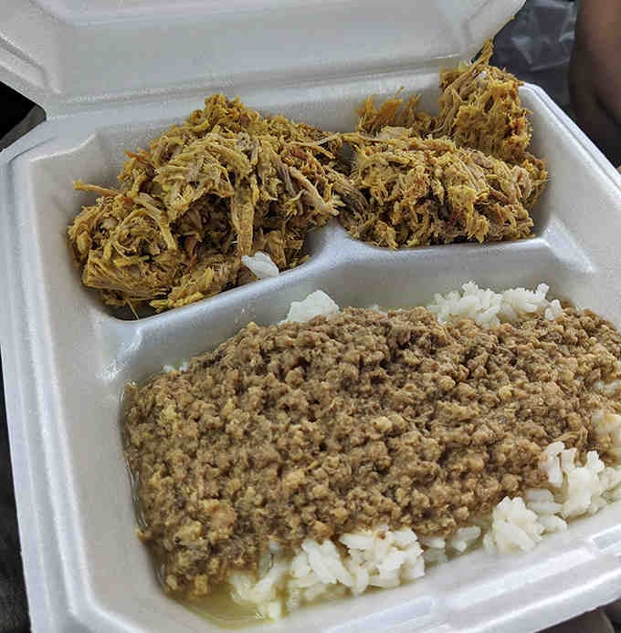 Pulled pork piled high enough to require architectural support, served with the classic Carolina sides.