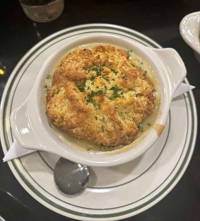 Golden-topped chicken pot pie in its crock looks like something June Cleaver would serve, but better.