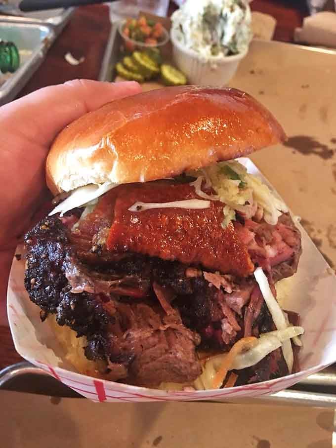 When your sandwich is this stacked with tender brisket, you'll need both hands and zero shame.