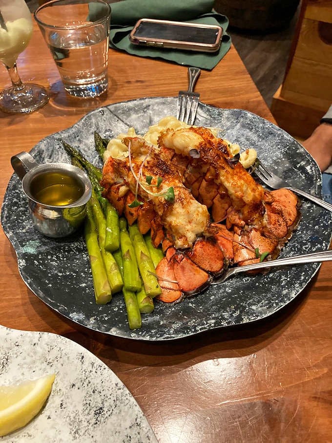 Lobster tails and asparagus make quite the power couple, proving that surf and turf never goes out of style.