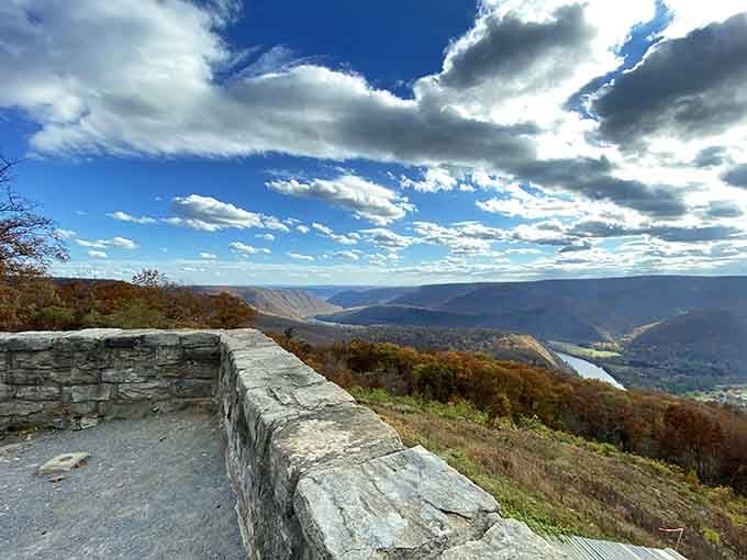 Stone walls frame mountain ridges stretching forever, like nature's own IMAX theater without the sticky floors.
