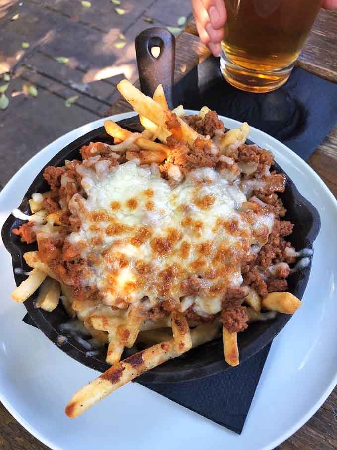 Loaded fries topped with enough cheese to make your cardiologist nervous and your taste buds ecstatic&mdash;worth every glorious bite.