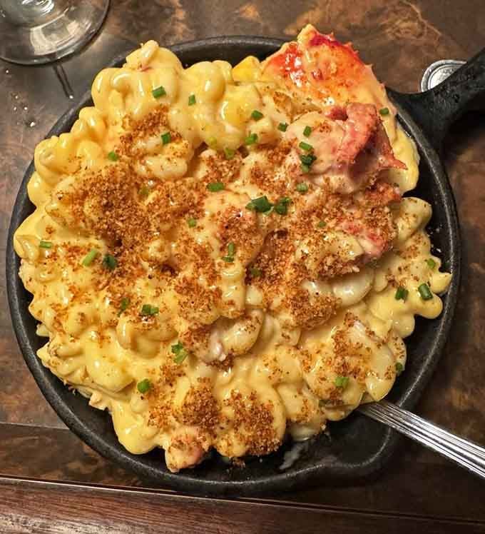 Lobster mac and cheese in a cast iron skillet proves some indulgences are absolutely worth every single calorie.