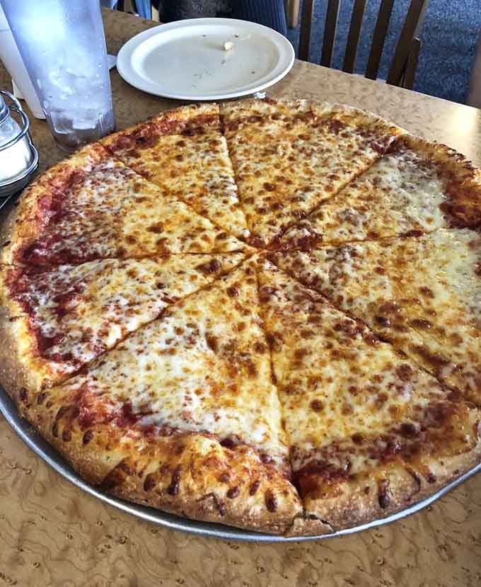 A classic cheese pizza done right is like a perfect song; simple, satisfying, and impossible to mess up when done well.