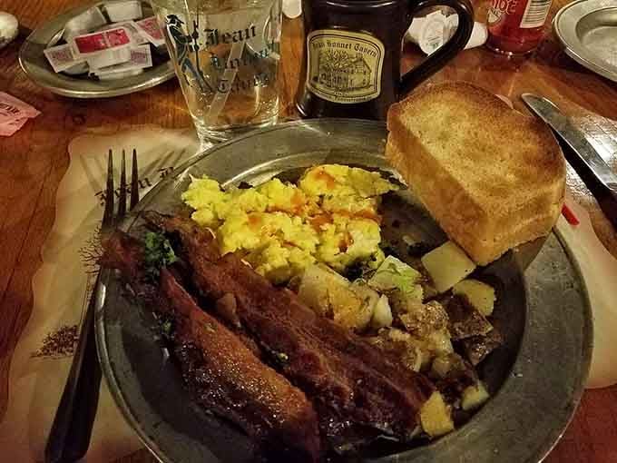 Breakfast plates featuring eggs, home fries, and toast, proving this tavern feeds people well around the clock too.