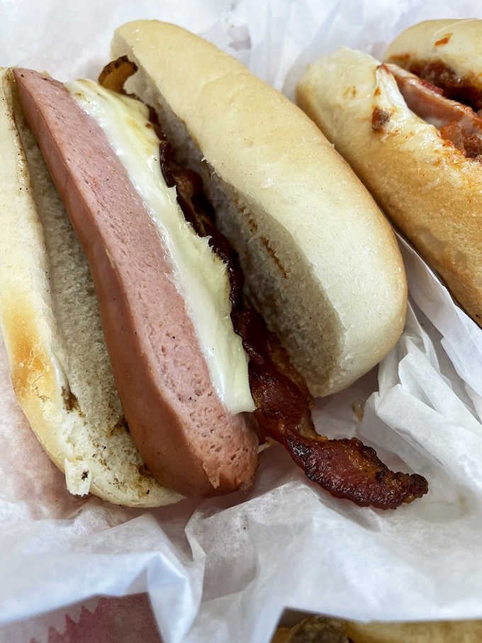 Bacon, cheese, and a grilled frank walk into a roll, and nobody leaves disappointed with this combination.