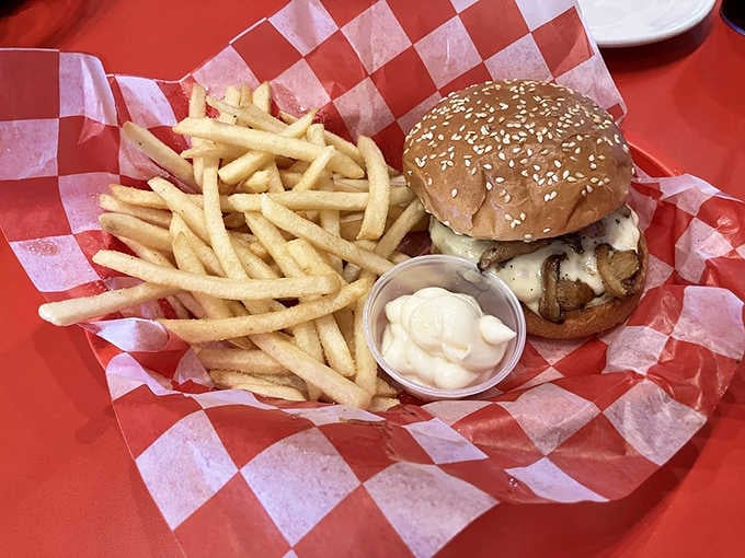 The mushroom Swiss burger on a sesame seed bun, where earthy meets beefy in delicious matrimony.