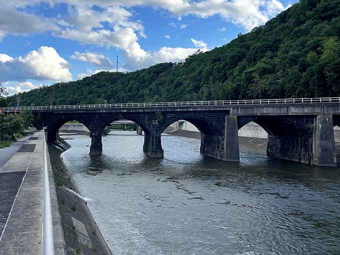 The Stone Bridge spans the Conemaugh River with architectural grace, connecting past to present without charging a toll for the privilege.